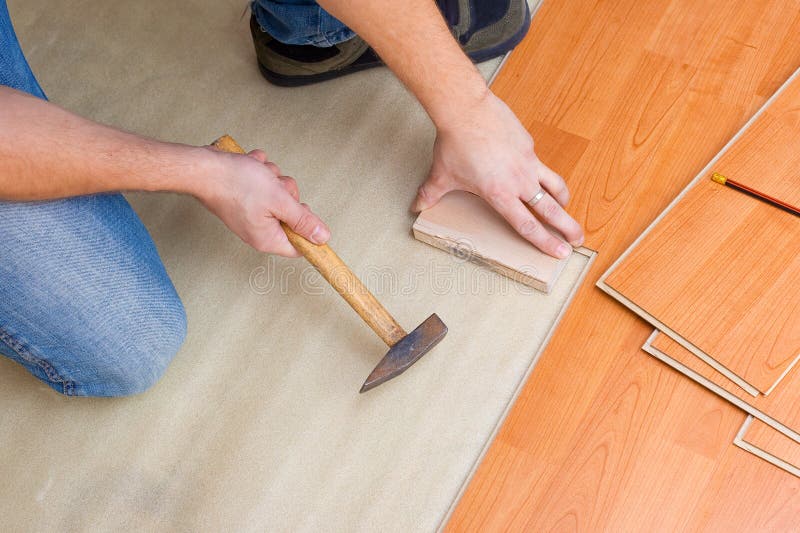 Laying laminate floor stock image. Image of handsome - 12111301