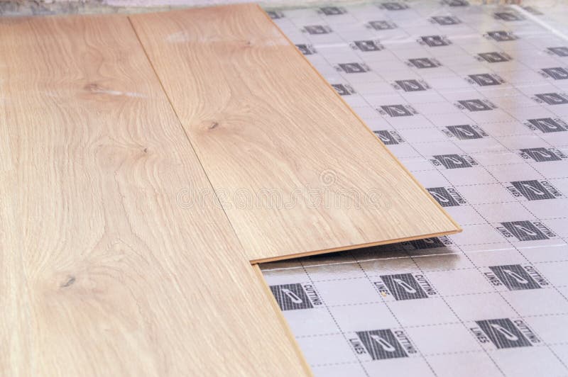 Laying Laminate Flooring - Close-up on Floor Panel Stock Photo - Image ...
