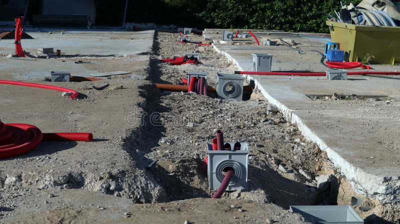 Laying Multiple Communications Lines in Rocky Soil at a Construction ...