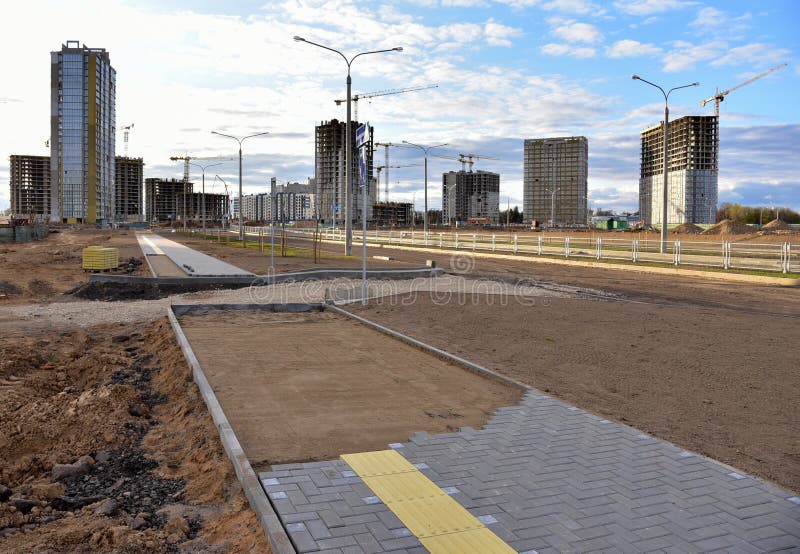 Laying Paving Slabs and Borders at Construction Site. Process of ...