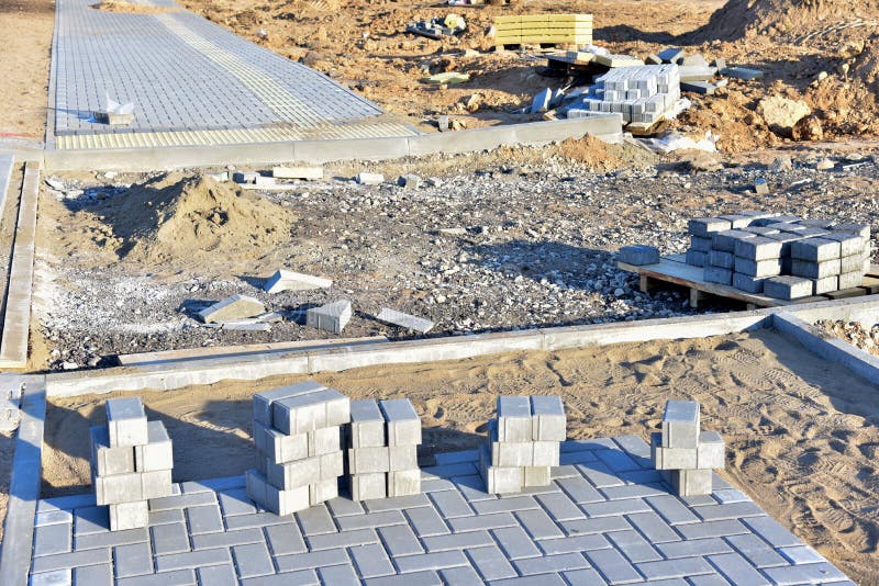 Laying Paving Slabs and Borders at Construction Site. Process of ...