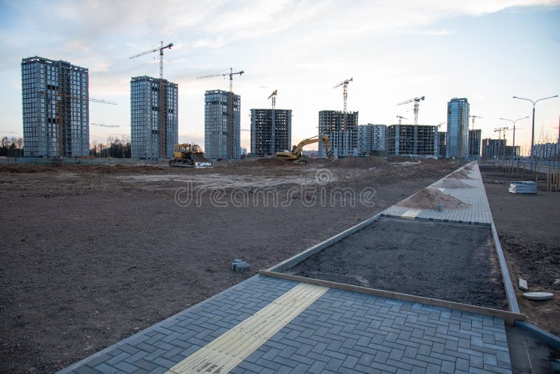 Laying Paving Slabs and Borders at Construction Site. Process of ...