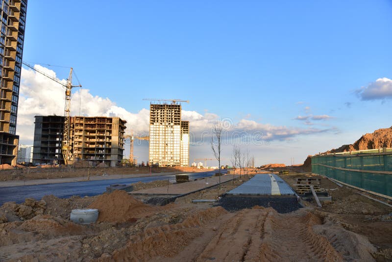 Laying Paving Slabs and Borders at Construction Site. Process of ...