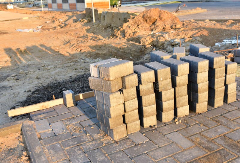 Laying Paving Slabs and Borders at Construction Site. Process of ...