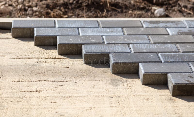 Laying Paving Slabs at a Construction Site. Stock Photo - Image of ...