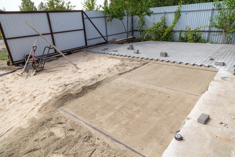 Laying Paving Slabs at a Construction Site. Stock Photo - Image of site ...