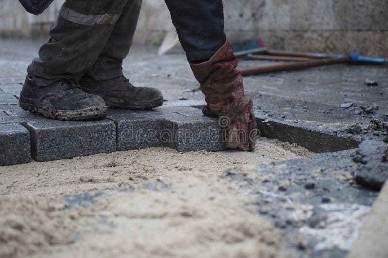 Laying Paving Stones on a Construction Site for a Driveway or Footpath ...