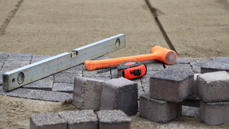 Laying Paving Stones. Paving Tools. Stock Image - Image of hand ...