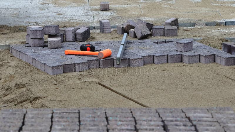 Laying Paving Stones. Paving Tools. Stock Photo - Image of brukowej ...