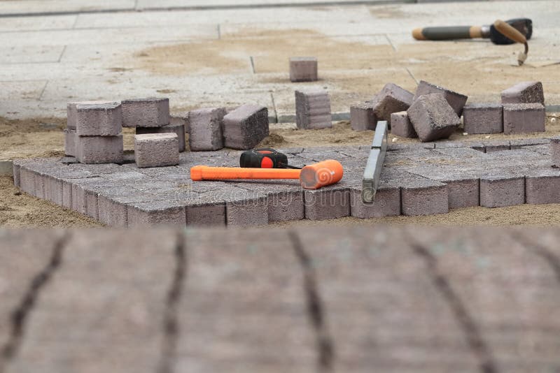 Laying Paving Stones. Paving Tools. Stock Photo - Image of construction ...