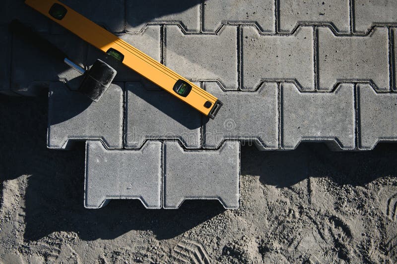 Laying Paving Stones. Paving Tools for Use Stock Photo - Image of ...