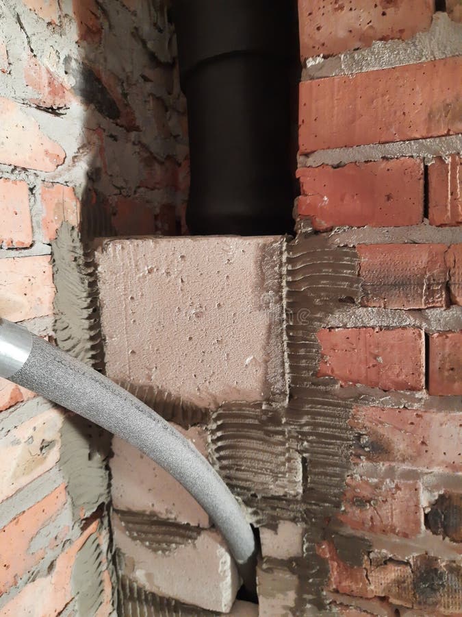 Laying the Pipeline in the Wall. Stock Image - Image of water, wall ...