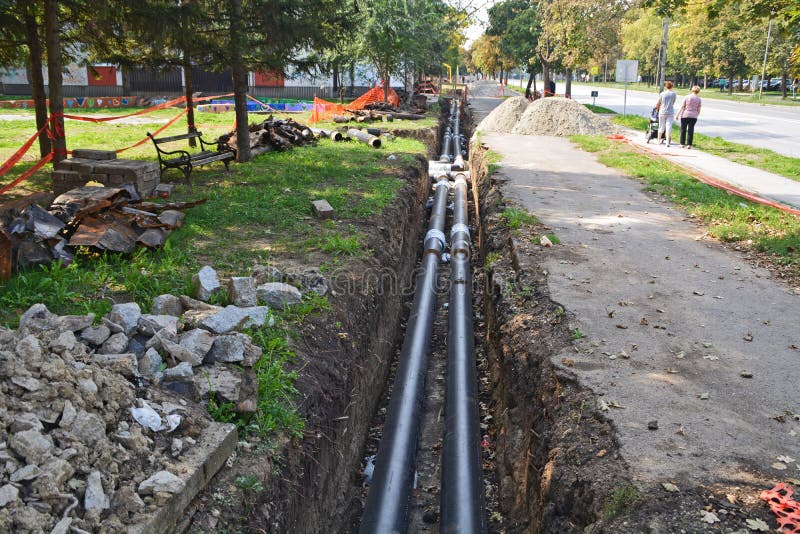 Laying Pipes Street Installation Stock Photo - Image of grass, heating ...