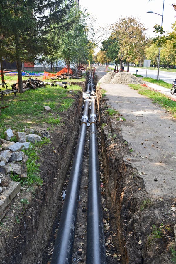 Laying Pipes Street Installation Stock Photo - Image of grass, heating ...