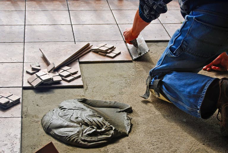 Man laying floor tile stock image. Image of trade, improvement - 11443401