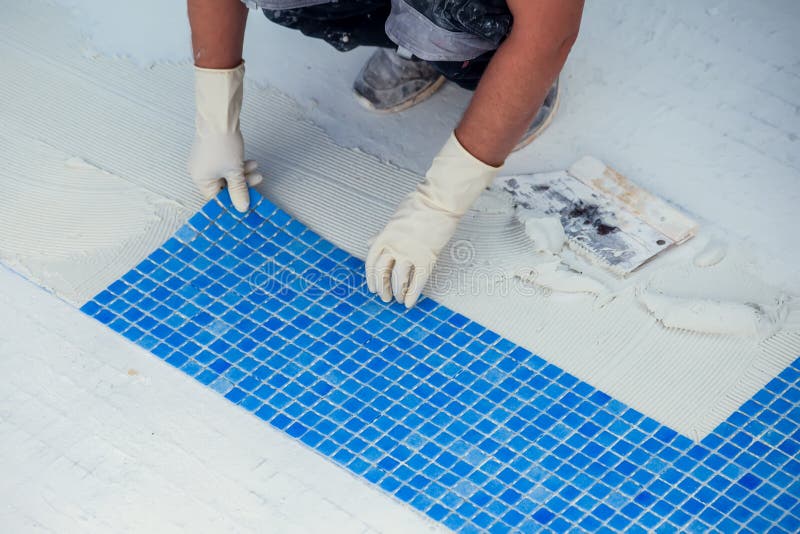 Laying Tile in the Pool. Pool Repairing Work Stock Photo - Image of ...