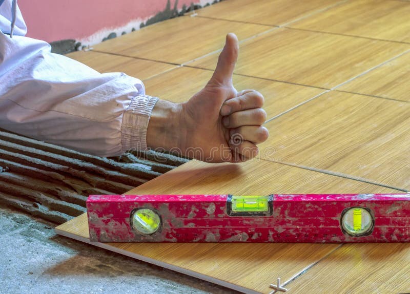 Laying Tiles on the Floor on the Building Level Stock Image - Image of ...