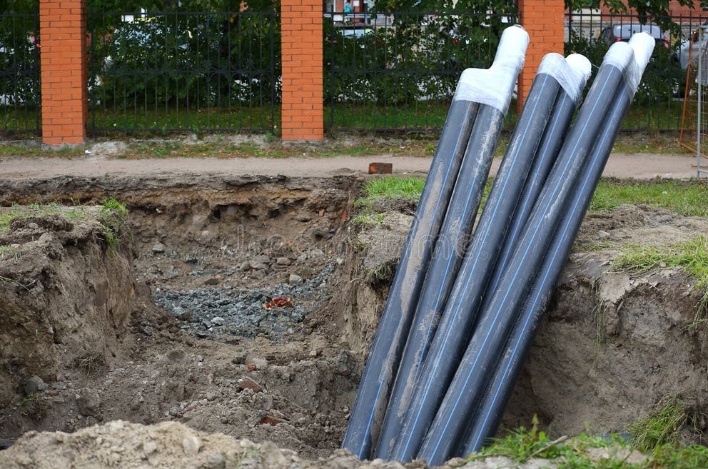 Laying of Underground Communication Cables in a Dug-out Ditch Stock ...