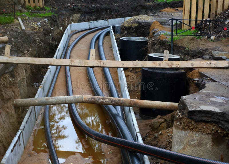 Laying of Underground Utilities Stock Photo - Image of communications ...