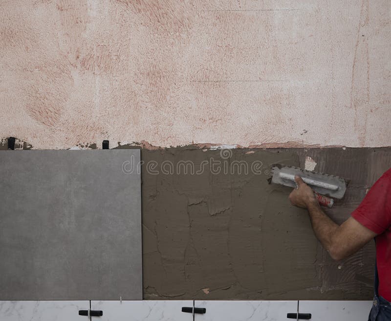 Installing Ceramic Wall Tiles with Tile Levelers Stock Photo - Image of ...