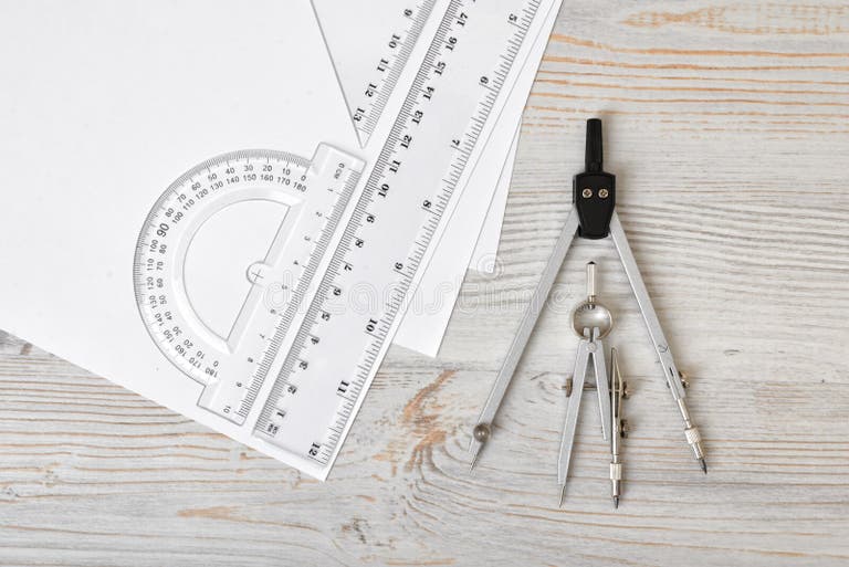 Layout with Compass, Protractor and Centimeter Ruler on Wooden Surface ...