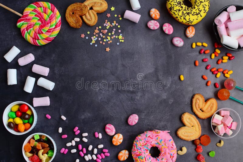 Layout of Multi-colored Sweets, Marshmallows, Dragees, Chocolate on a ...