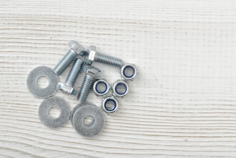 Layout with Nuts, Bolts and Washers Distributed on Wooden Surface Stock ...