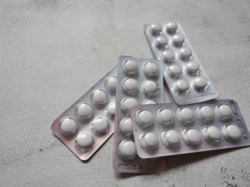 Layout of Tablets in Plastic Packaging on a Light Background Stock ...