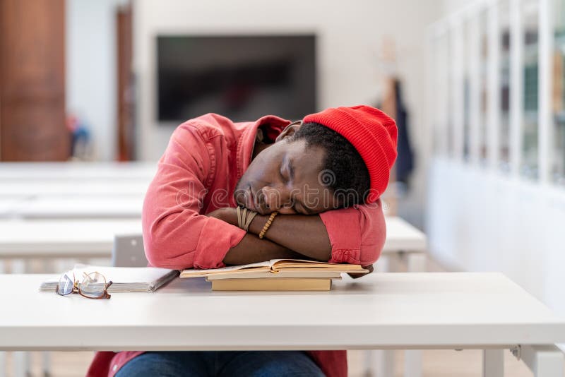 Lazy African Male Student Falling Asleep during Study in Library ...