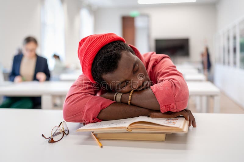 Lazy African Male Student Falling Asleep during Study in Library ...