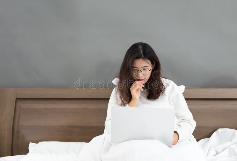 Lazy Chinese Girl Using Computer Bed Office Stock Image - Image of lazy ...