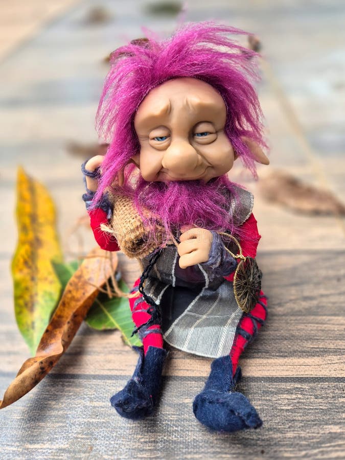 Lazy Elf Sitting on the Ground Next To Leaves. Stock Image - Image of ...