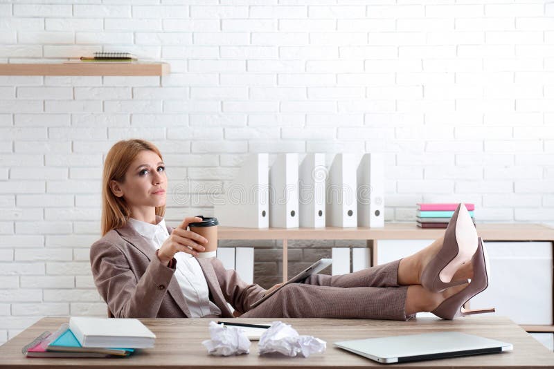 Lazy Employee Using Tablet while Resting at Table Stock Image - Image ...