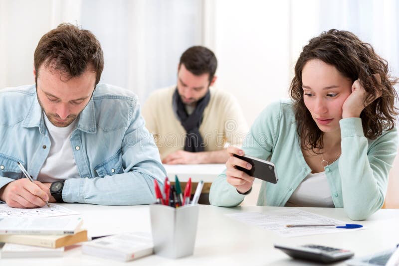 Lazy Girl at School Using Her Smartphone Stock Photo - Image of school ...