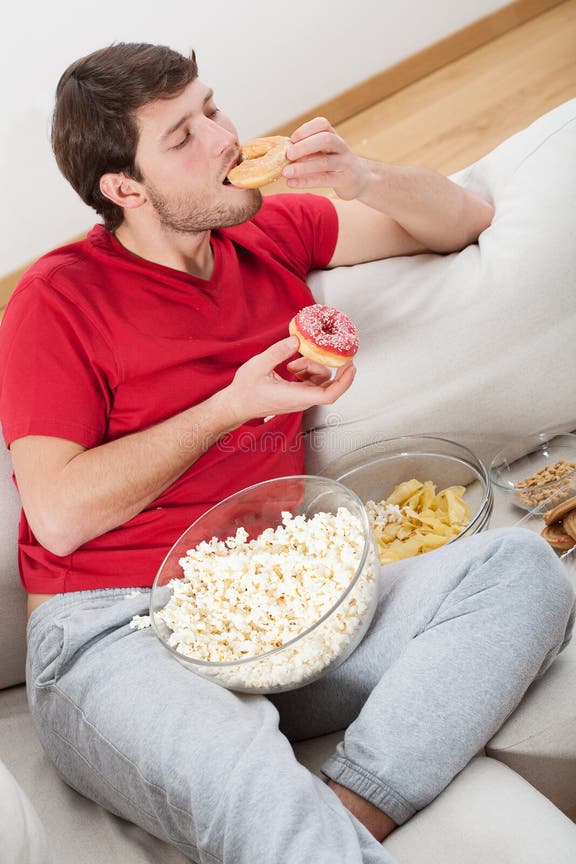 Lazy Guy on a Couch with Food Stock Photo - Image of adult, lifestyles ...
