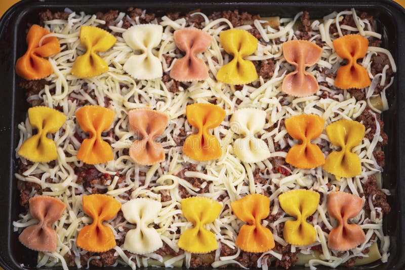 Lazy Lasagna with Colored Pasta Stock Image - Image of snack, icing ...