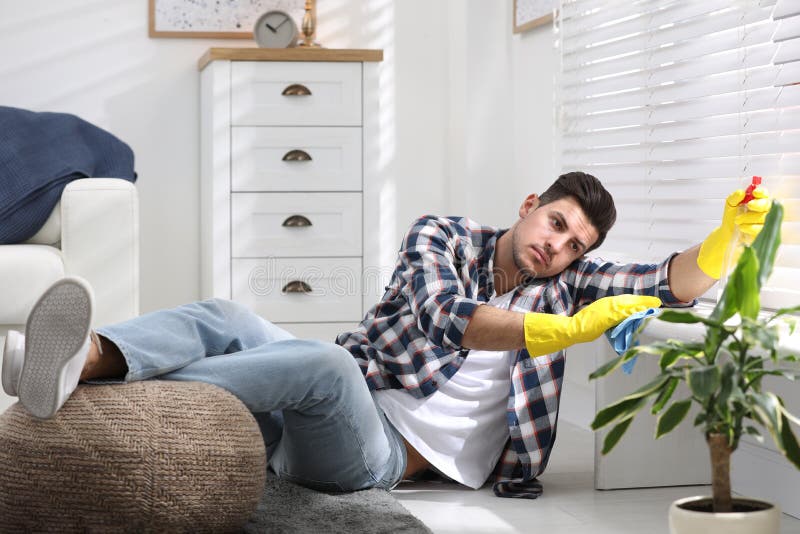 Lazy Man Procrastinating while Cleaning Stock Photo - Image of cleaning ...