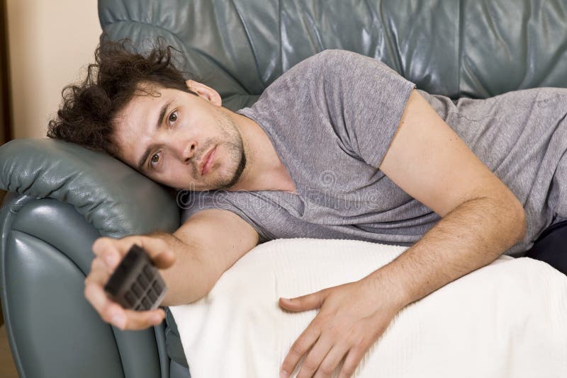Lazy Man with the Remote on the Couch Stock Image - Image of remove ...