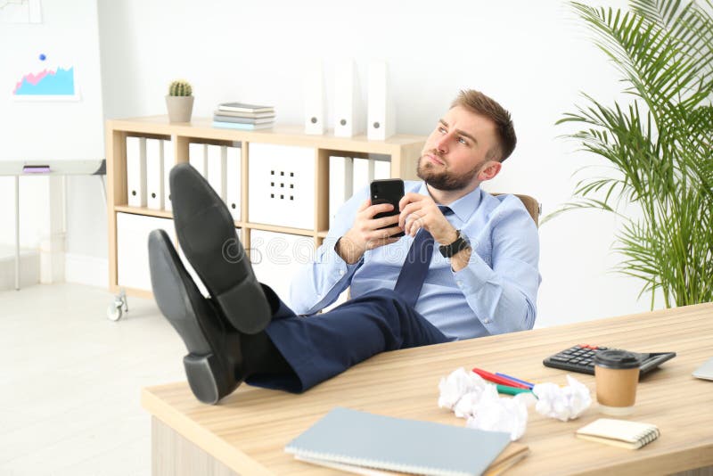 Lazy Office Employee with Mobile Phone Stock Image - Image of lazy ...