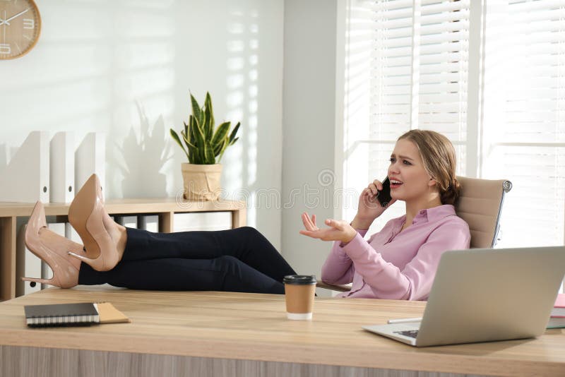 Lazy Office Employee Resting with Feet Up on Desk, Closeup Stock Photo ... Lazy Office Employee Resting with Feet Up on Desk, Closeup Stock Photo ...