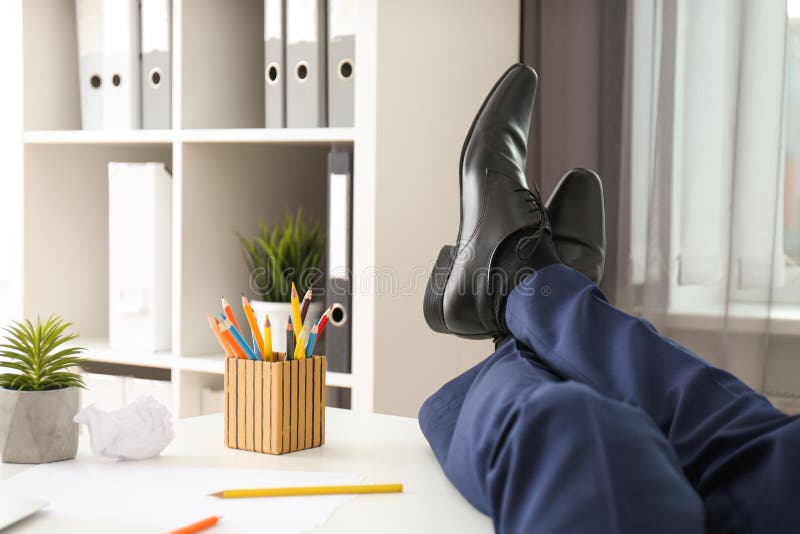 Lazy Young Man Resting with Feet on Desk in Office, Closeup Stock Image ... Lazy Young Man Resting with Feet on Desk in Office, Closeup Stock Image ...