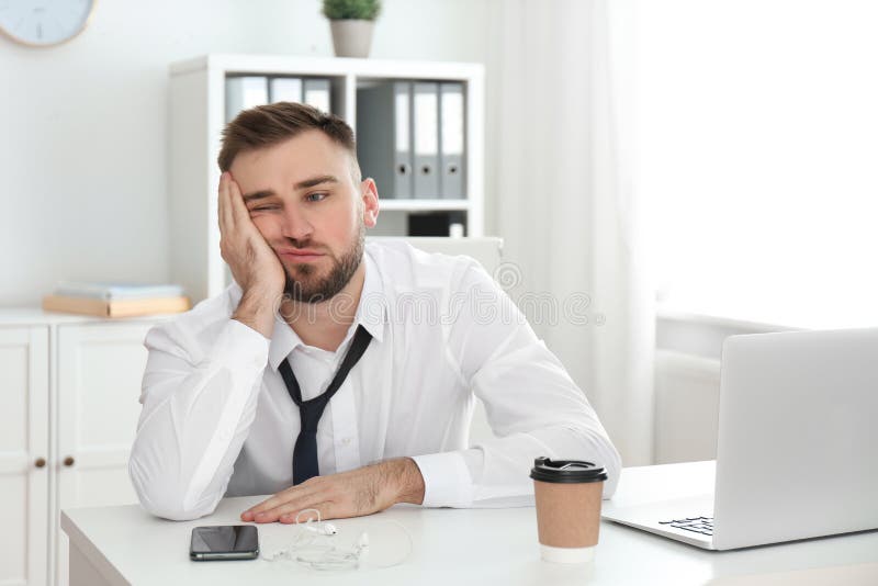 Lazy Young Man Wasting Time at Table Stock Image - Image of phone, desk ...