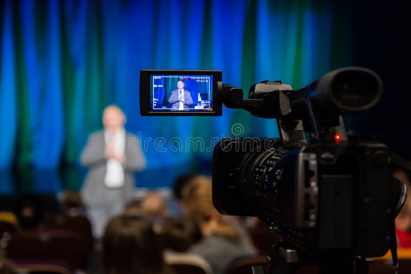 The LCD Display on the Camcorder. Shooting Event. a Man Stands in Front ...
