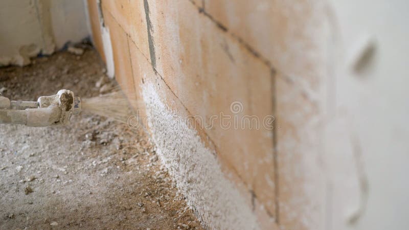 A Wall Being Covered in a Layer of Plaster. LD Plaster Being Sprayed ...