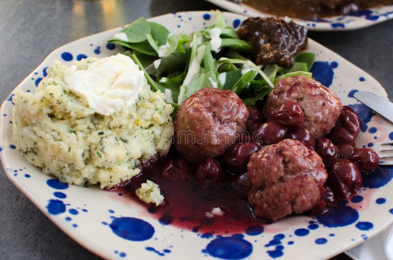 Le Boulet with Cherry Sauce and Mash Stock Photo - Image of meal, herbs ...