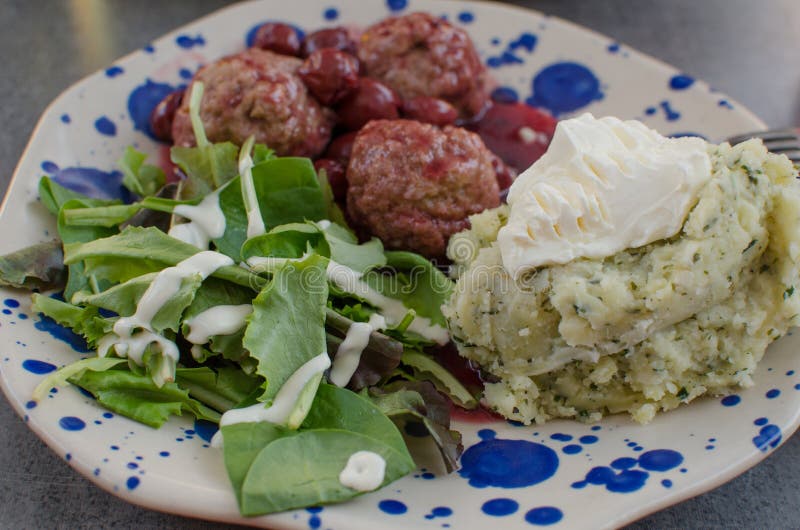 Le Boulet with Cherry Sauce and Mash and Herbs Stock Photo - Image of ...