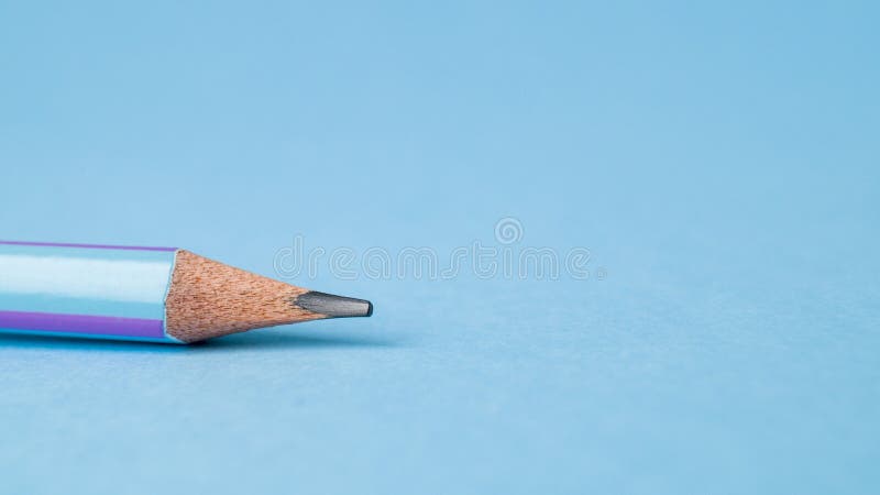 Lead of Blue Pencil. Sharpened Simple Pencil on a Blue Background ...