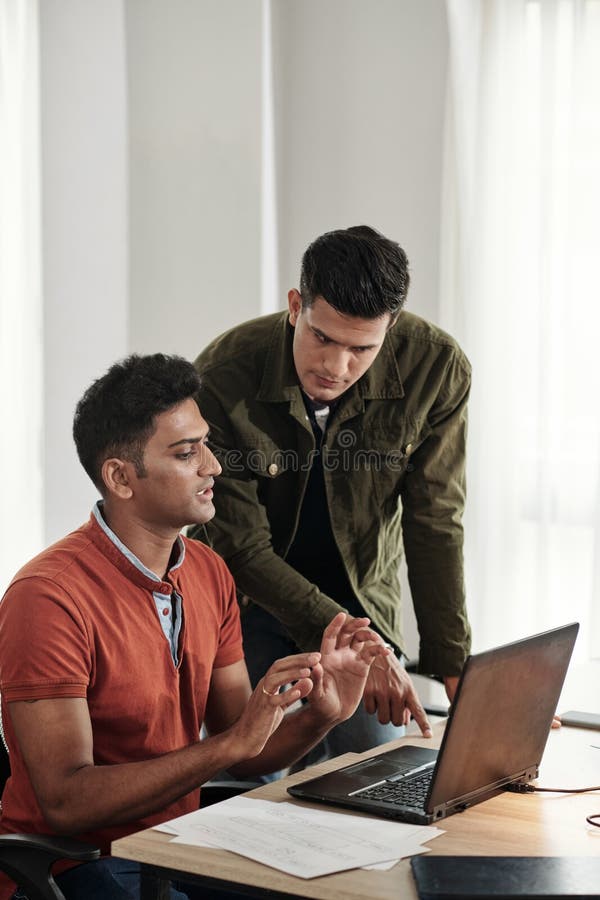 Lead Developer Guiding Colleague Stock Image - Image of business ...