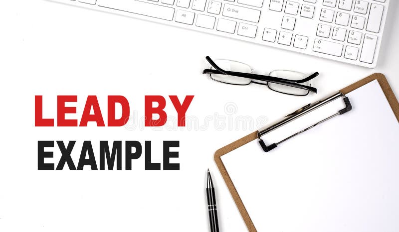 LEAD by EXAMPLE Text on Notebook with Office Supplies on White ...