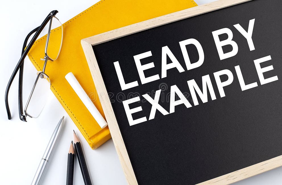 LEAD by EXAMPLE Text on the Blackboard with Notepad , Pen, Pencil Stock ...